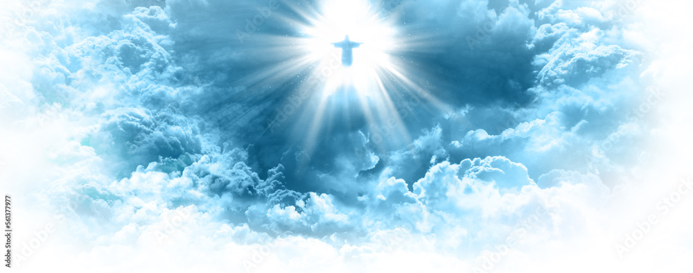 Jesus Christ in the blue sky with clouds, bright light from heaven ...