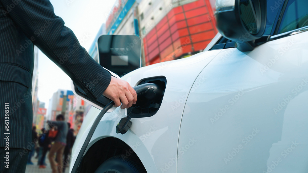 Electric vehicle charging energy from charging station in city urban ...