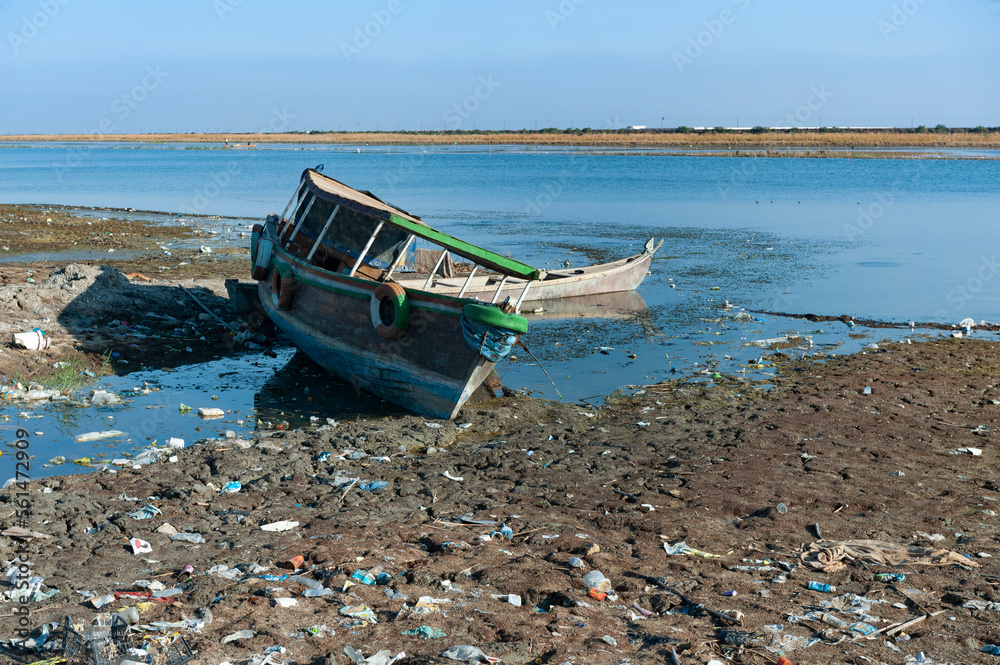 Abandoned boats on the receding shoreline of the Euphrates River in the ...