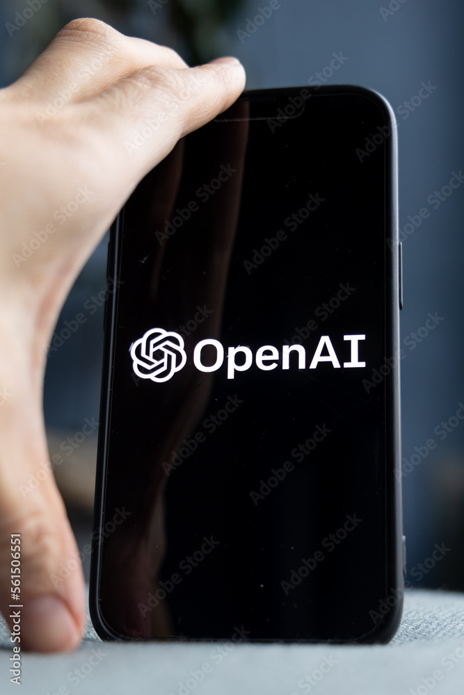 Foto de Woman's hand holding an iPhone with OpenAI logo. ChatGPT and ...
