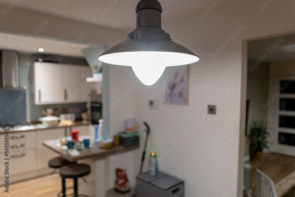 Shallow focus of a bright ceiling light seen in a Kitchen location. The ...