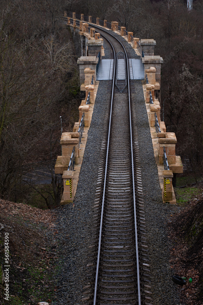 Bird's eye view of a railway bridge. The rail passes over a stone ...