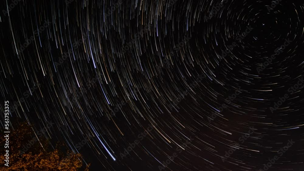Stars leave trails in the night sky around the Pole star. Rotation of ...