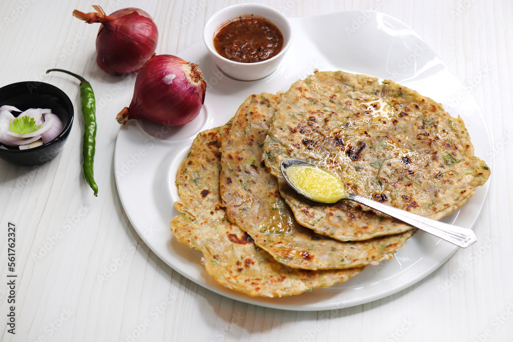 Indian traditional Hot Onion Paratha with tomato chutney. Indian onion ...