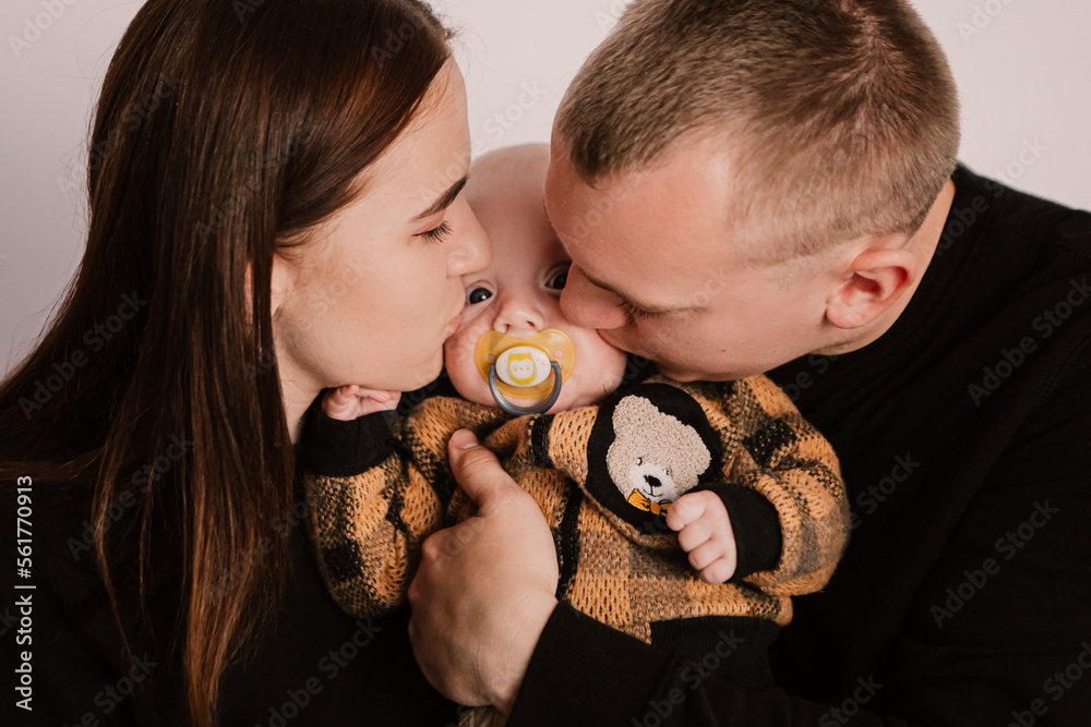 Little boy cute child baby, parents kissing crying unhappy kid. Playful ...
