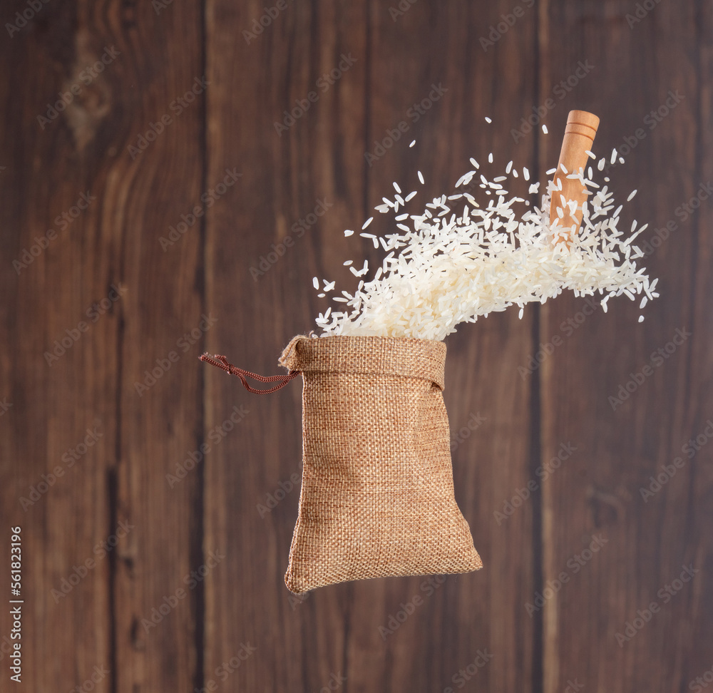 Japanese Rice in sack bag flying explosion, white grain rices fall ...