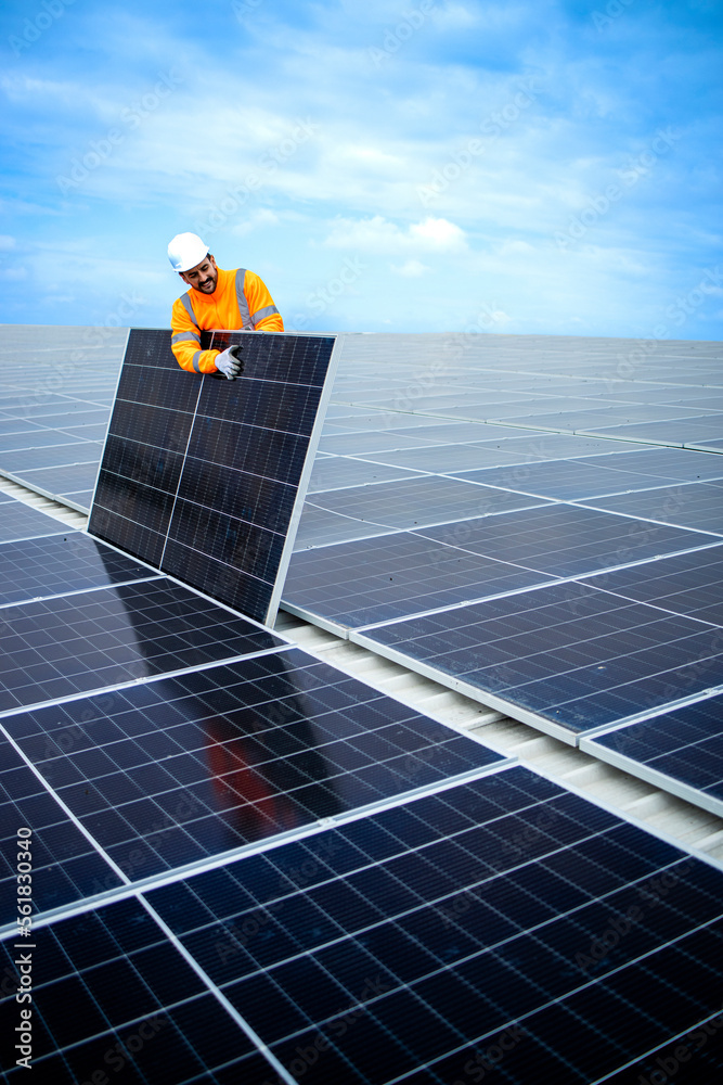 Installing solar power plant as sustainable energy source. Worker ...