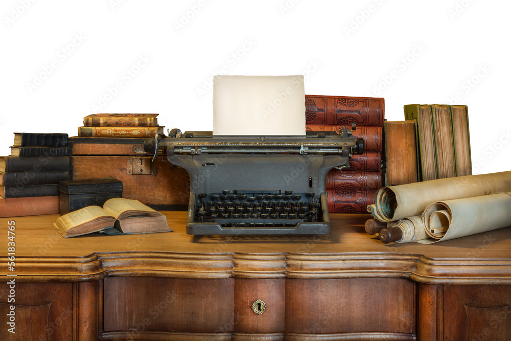 Old wooden desk with vintage typewriter holding an empty sheet of paper ...