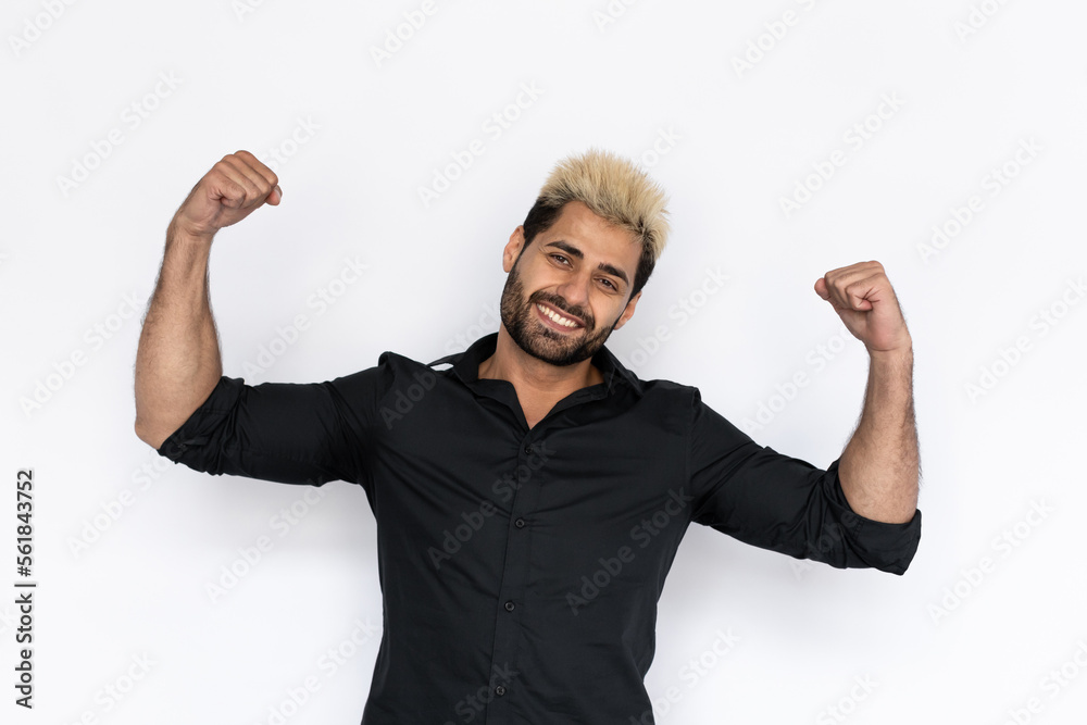 Winsome young man showing his arm muscle. Male Caucasian model with ...