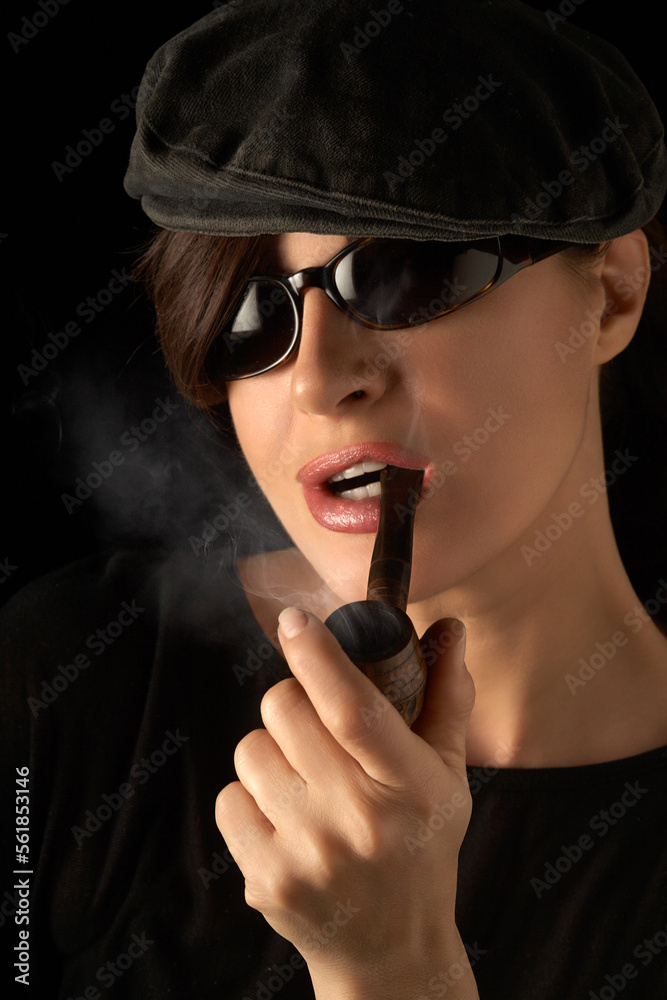 Gorgeous brunette woman smoking pipe. Smoking lady with a vintage ...
