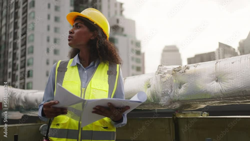 Civil engineer woman dark skin wearing uniform and safety helmet under ...