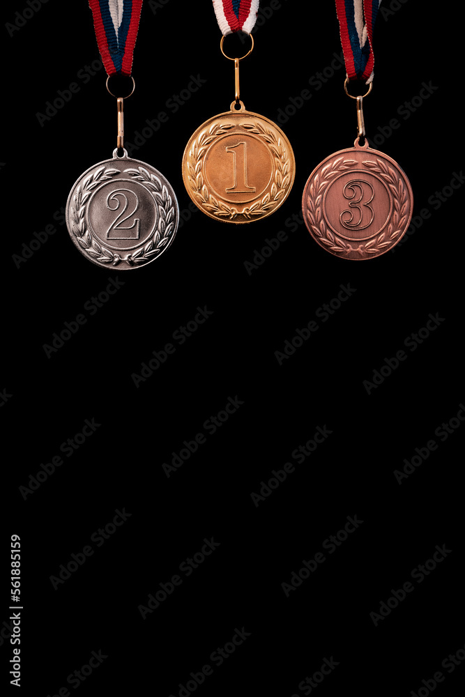 Gold, silver and bronze medals with numbers on black isolated ...