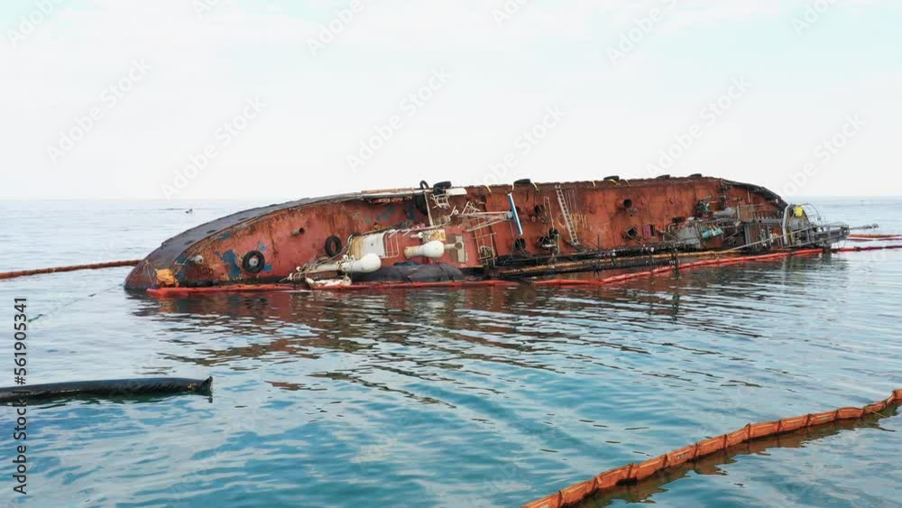 Broken rusty oil tanker ship in the shallow water. Sunken drowned ship ...