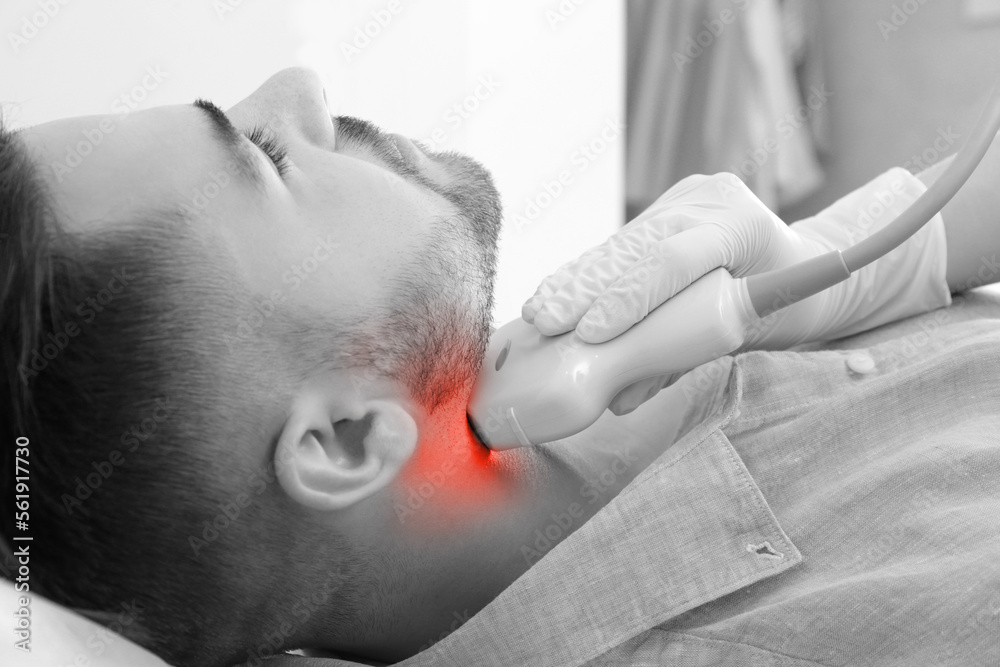 Endocrine system. Medical specialist conducting ultrasound examination ...