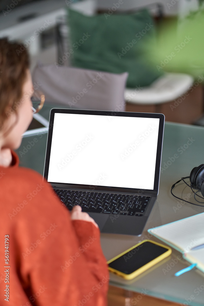Over shoulder view of woman student elearning looking at white mock up ...