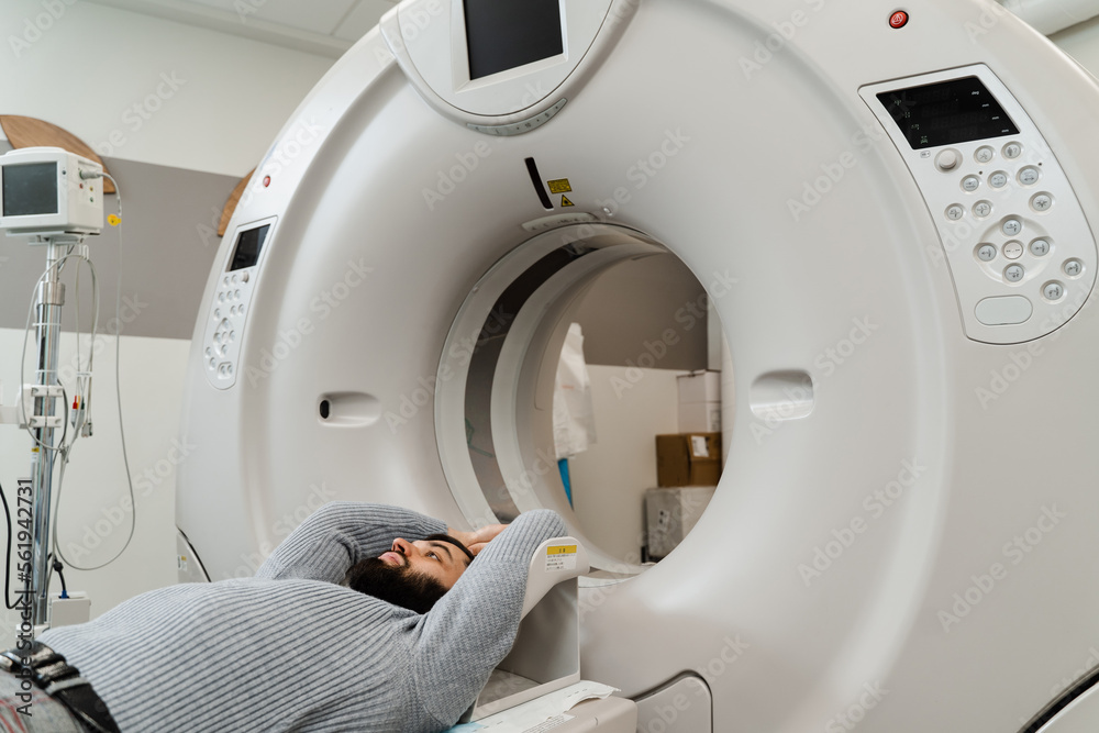 CT scan of abdominal of man in medical clinic. Man is doing computed ...