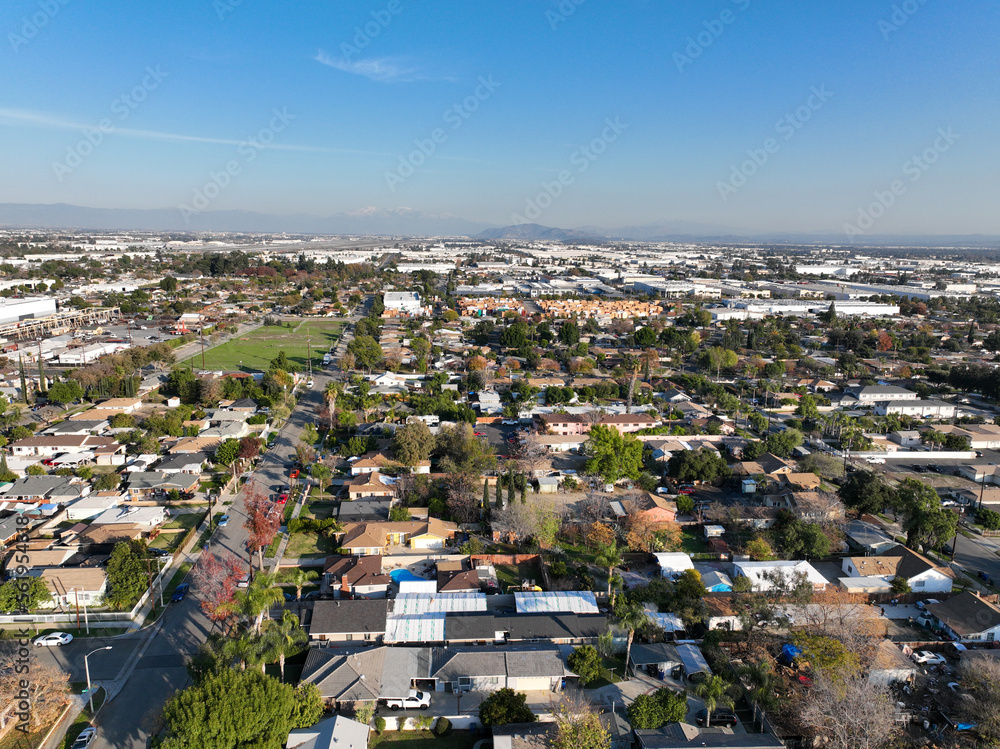 Aerial view of Ontario city in California with mountains in the ...