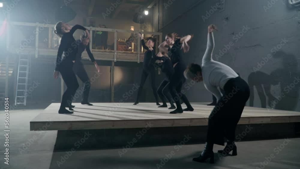 Wide shot talented actors actresses and stage director moving bodies ...