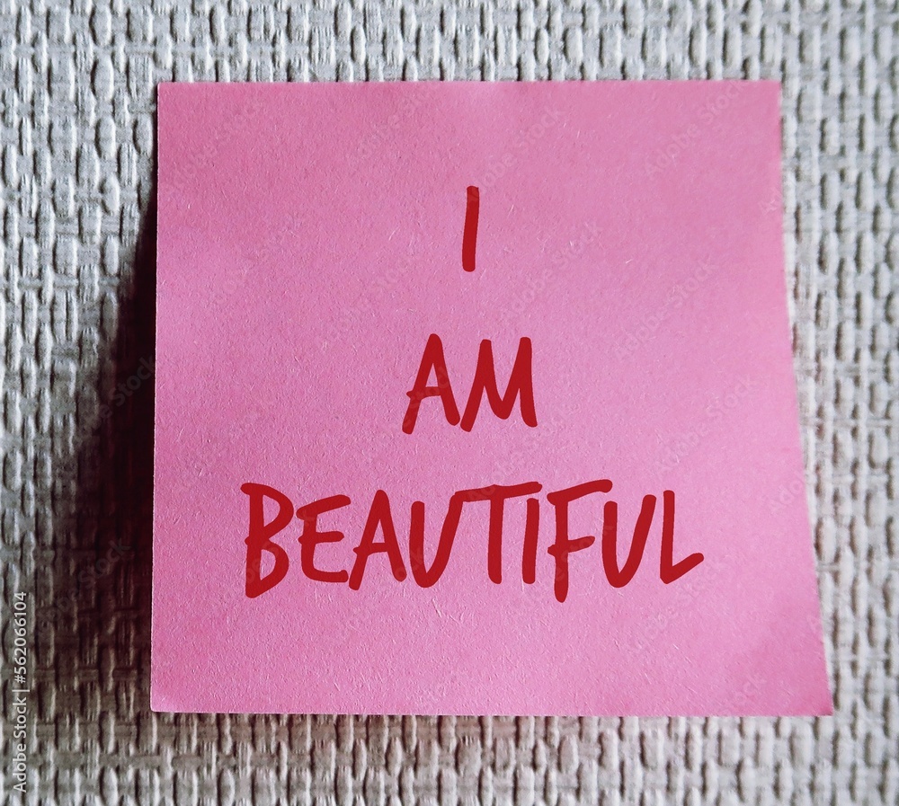 Pink note on wallpaper background with text I AM BEAUTIFUL, self-love ...