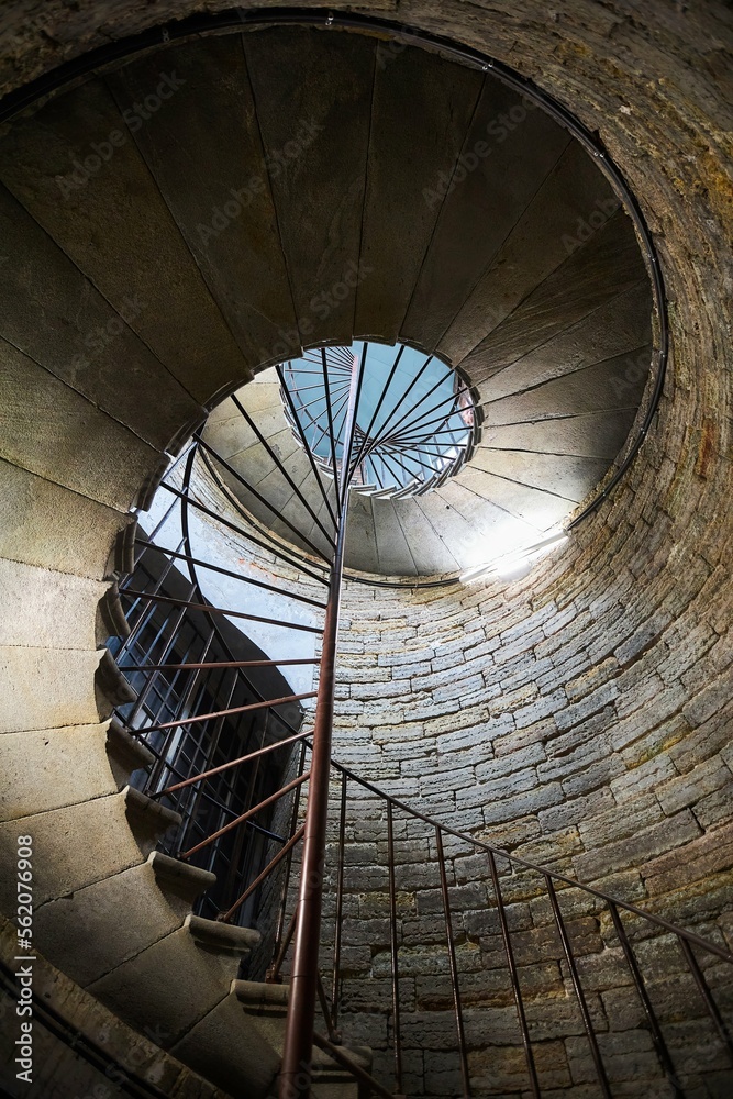 Spiral staircase in the tower of an ancient building. Castle or palace ...