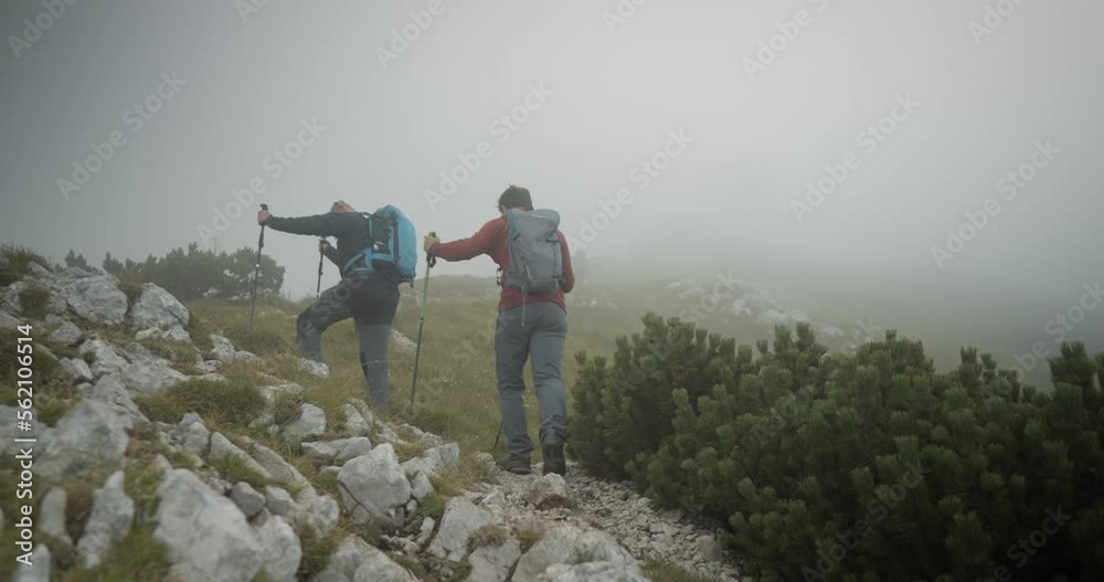 Camera tracking two hikers on there path to the top of mountain Stol ...