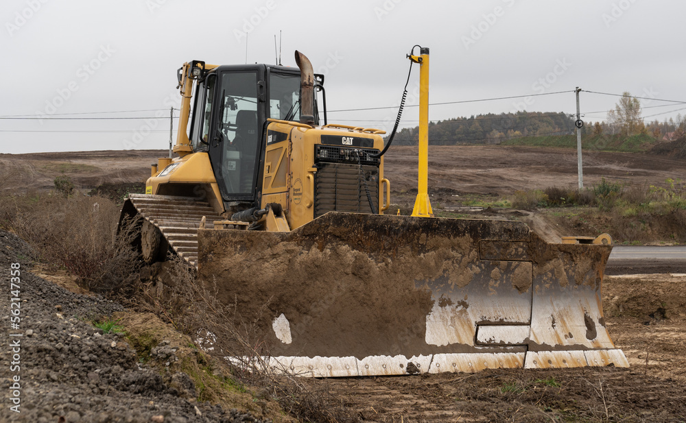 Caterpillar D6N LGP crawler dozer with a metal blade for pushing ...