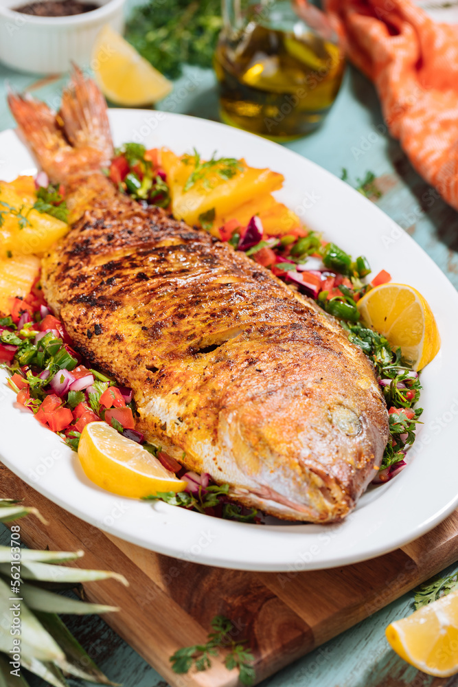 Red Snapper with ingredients. Prepared in tropical taste with Pico de ...