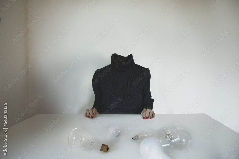headless indecisive surreal person looks for the right light bulb for ...