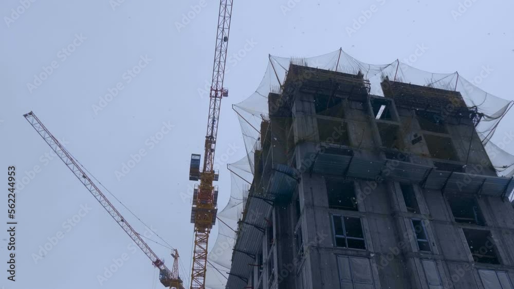 Construction site, where a modern beautiful multi-storey building is ...