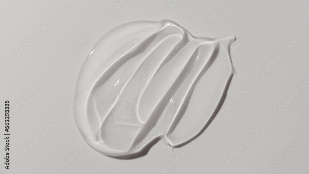 Colorless face care gel smears appear from the shadow on white ...