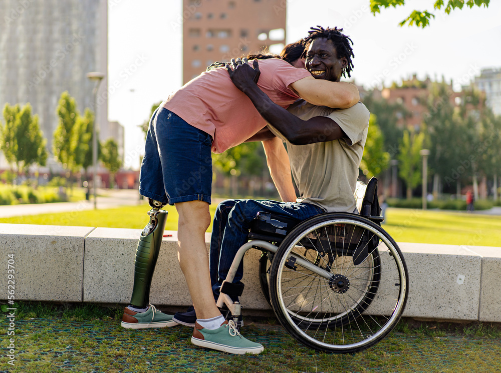 Support and Friendship: Men with Disabilities Embrace in a City Park ...