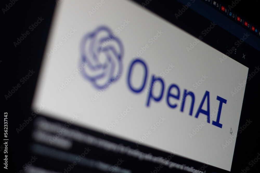 blurred OpenAI logo seen on the screen of monitor computer . Open AI is ...