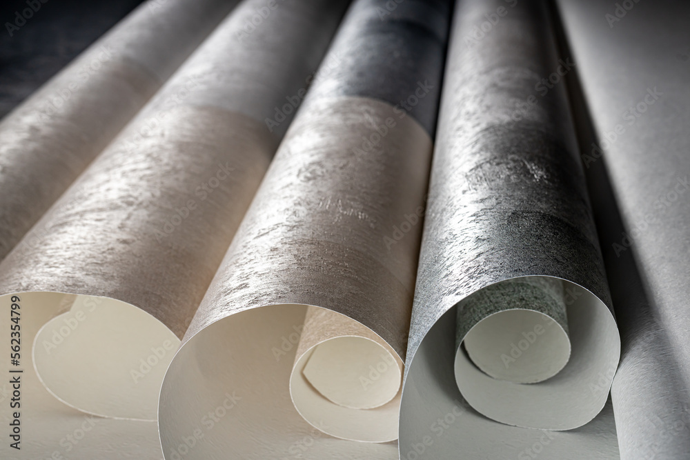 Poster A roll of vinyl wallpaper with a beautiful paper texture in low ...