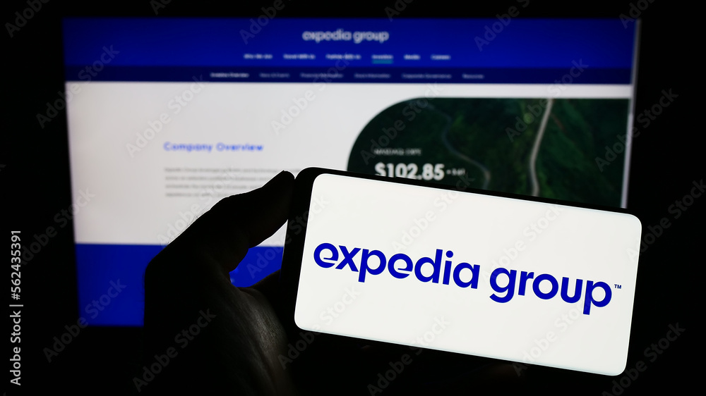 Stuttgart, Germany - 01-12-2023: Person holding mobile phone with logo ...