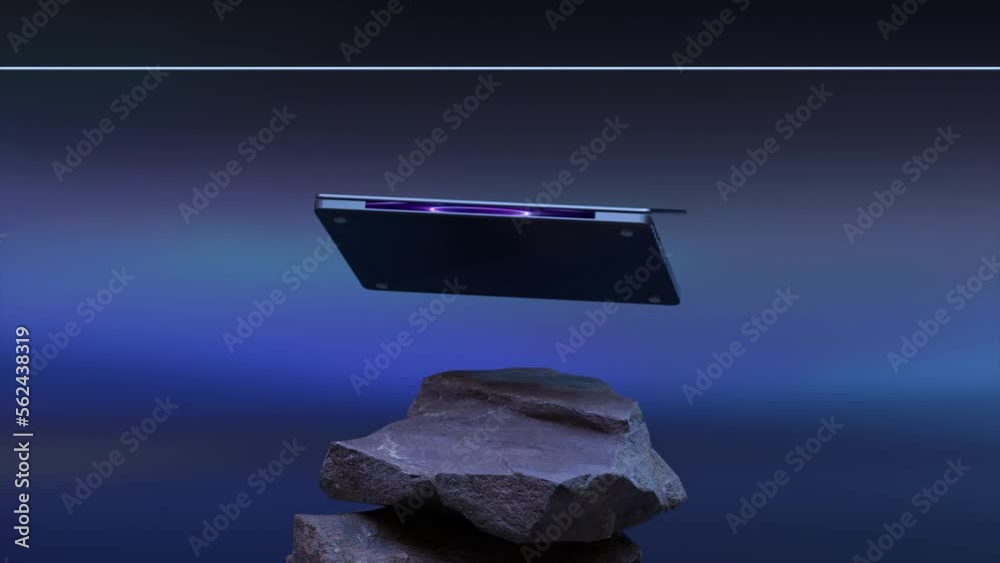 Technological concept. The laptop flies and rotates over the stone ...