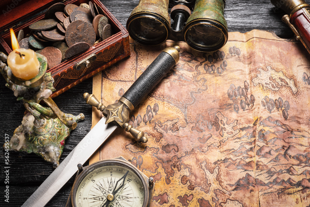Ancient pirate treasure map, compass, chest with ancient coins and ...