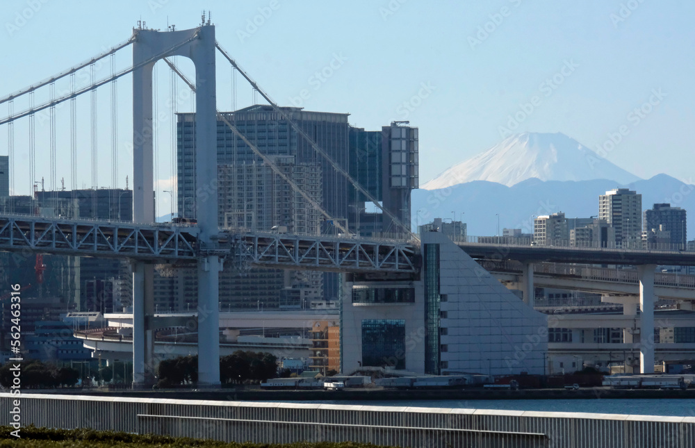 Rainbow Bridge going over Tokyo Bay in Tokyo, Japan, with mount Fuji in ...