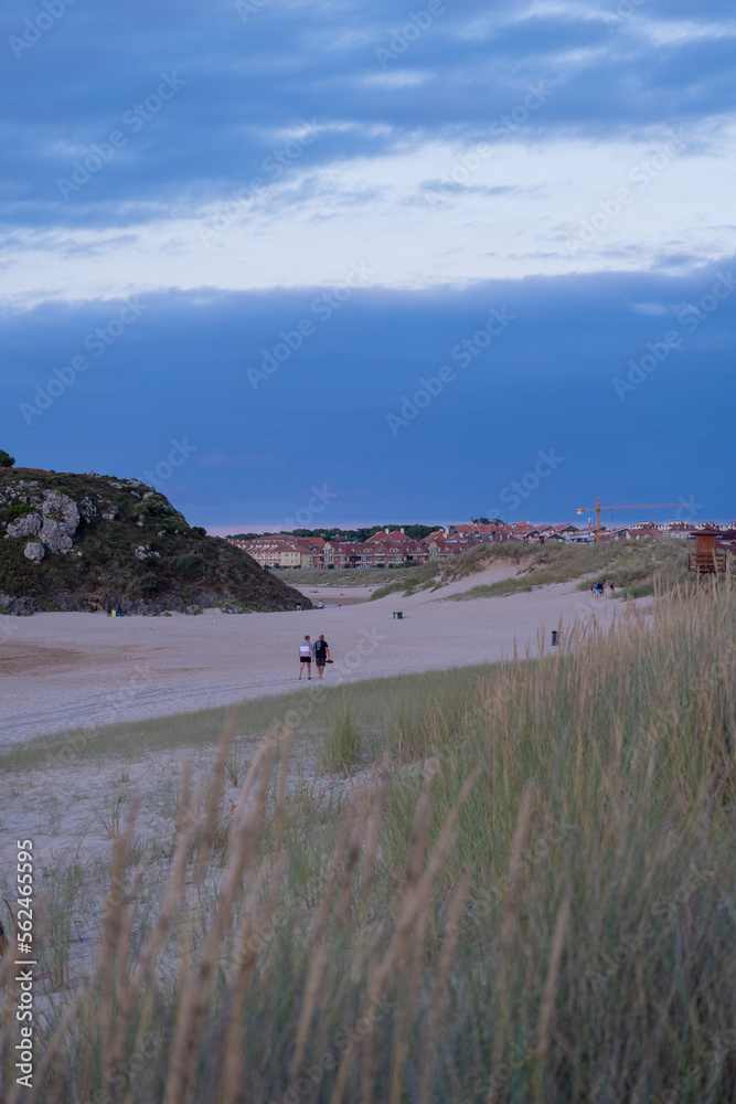 Sea view with beach and a colorful sky above the blue sea. The beach ...