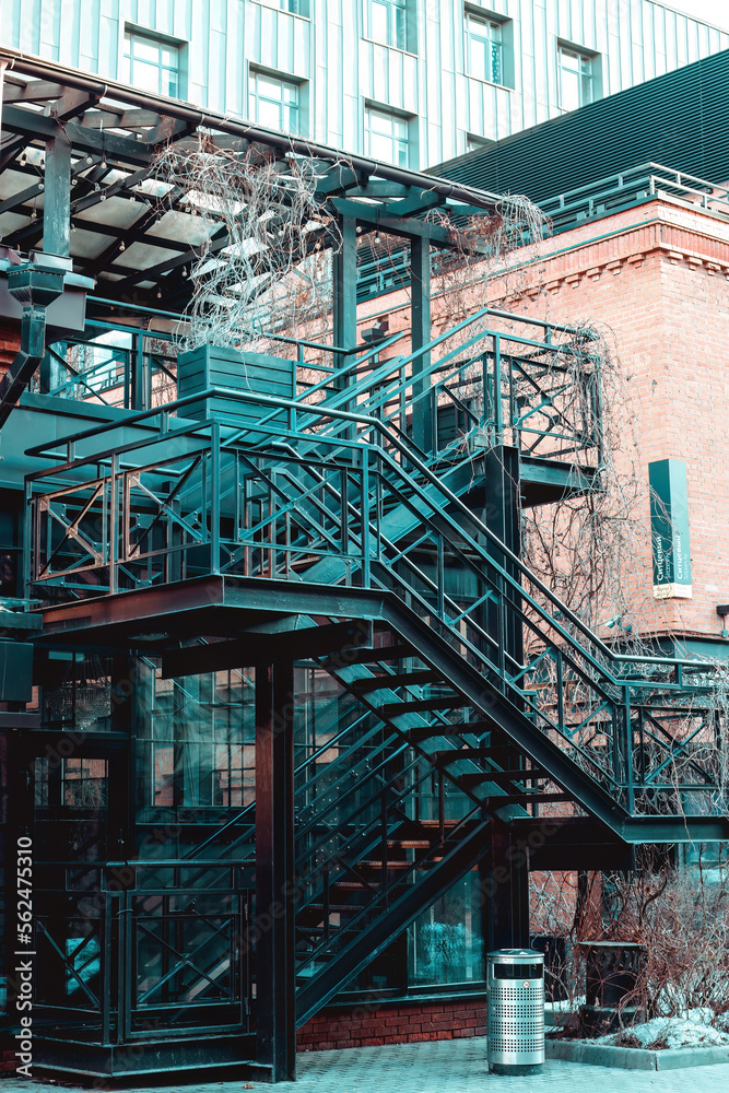 stair for fire escape with the steel railing and ladder on side of ...