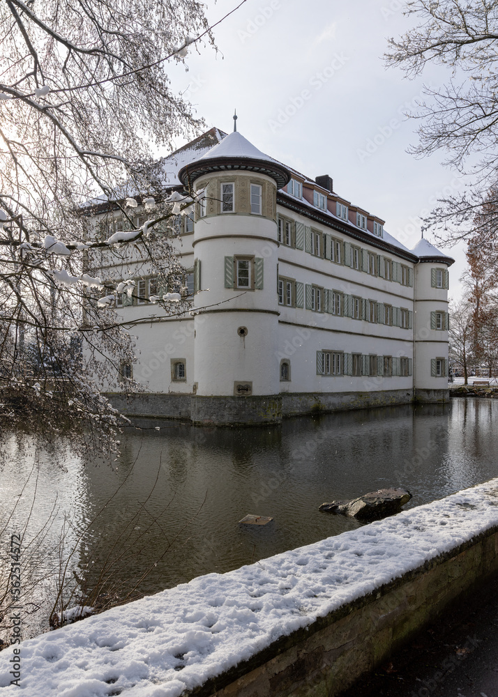 old moated castle of Bad Rappenau in winter with snow, moat and ...