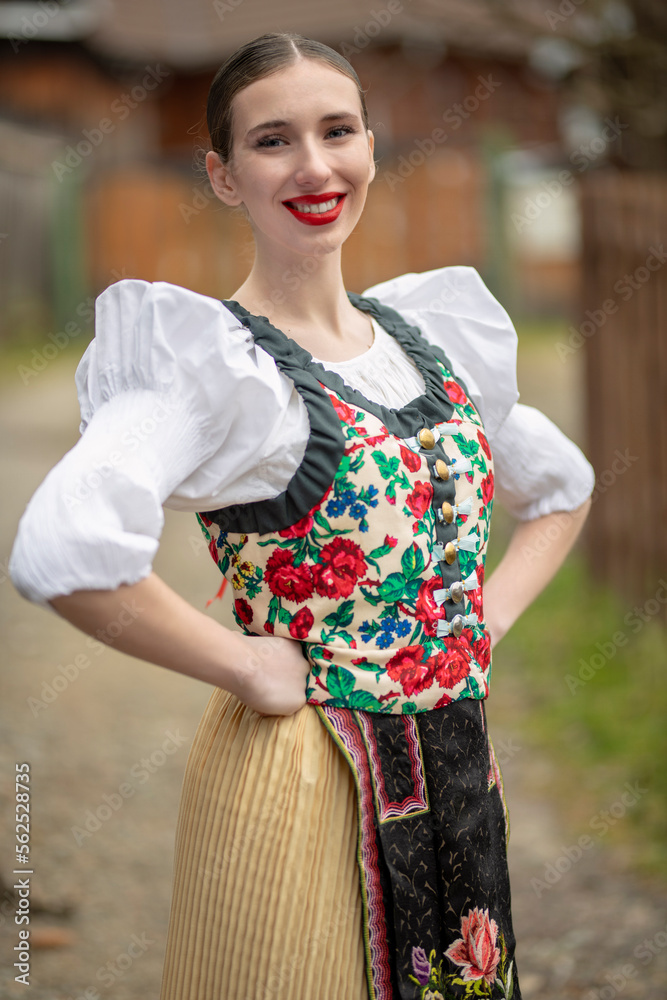 Young beautiful slovak woman in traditional dress. Slovak folklore ...