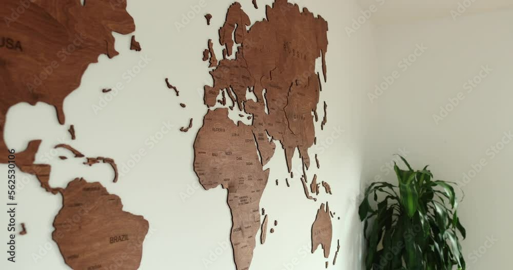 Wooden world map pan full view in modern room with white wall design ...