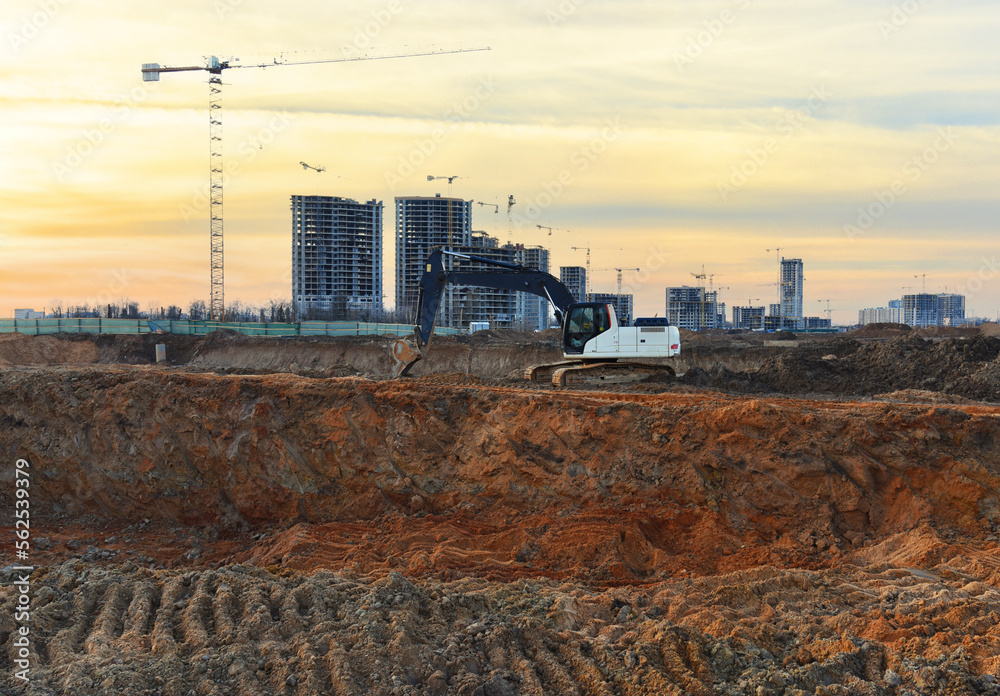 Excavator dig ground at construction site. Dig foundation. Construction ...