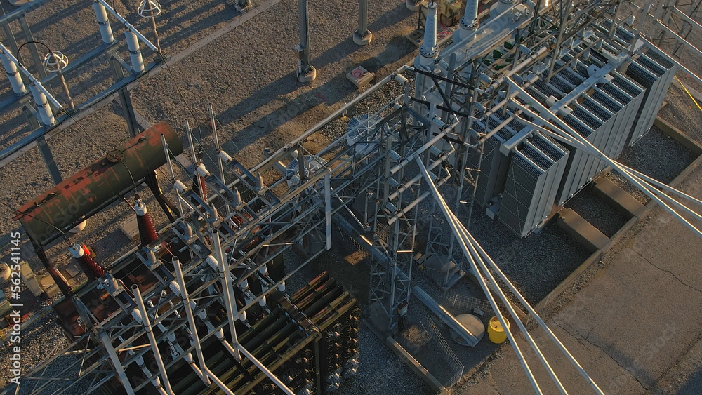 High voltage substation with pylons and distribution cables ...