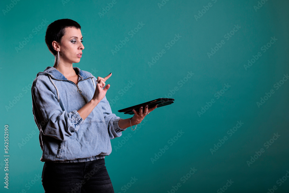 Confident woman holding digital device using holographic database ...