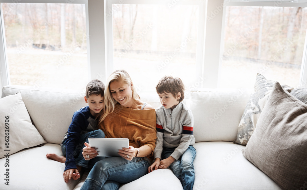 Tablet, home and mother with children on sofa bonding, quality time and ...