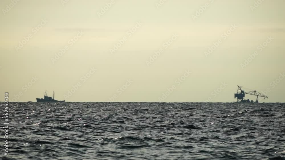 Floating Crane Vessel On Sea. Tugboat tows large crane vessel on sea ...