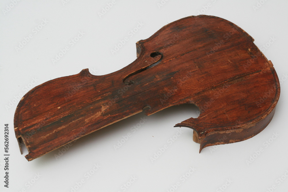 Broken antique violin for restoration with a lot of damage on white ...