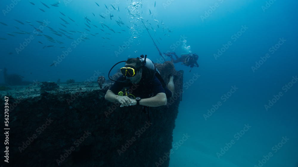 male diver posing in front of a sunken ship, technical diving Stock ...
