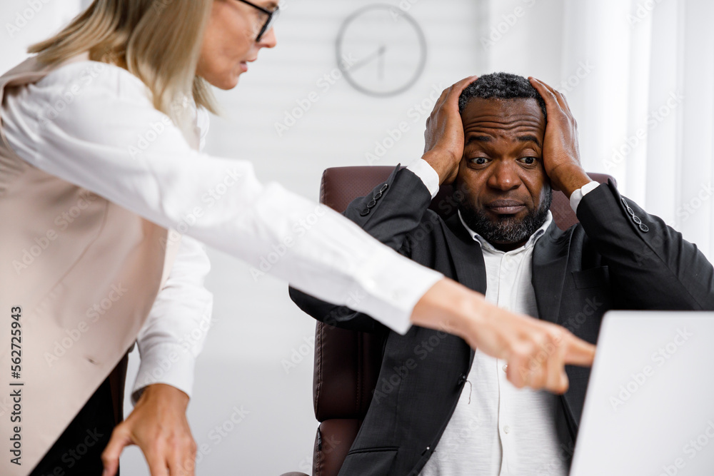 Angry Female Boss Scolding African American Office Worker A Demanding